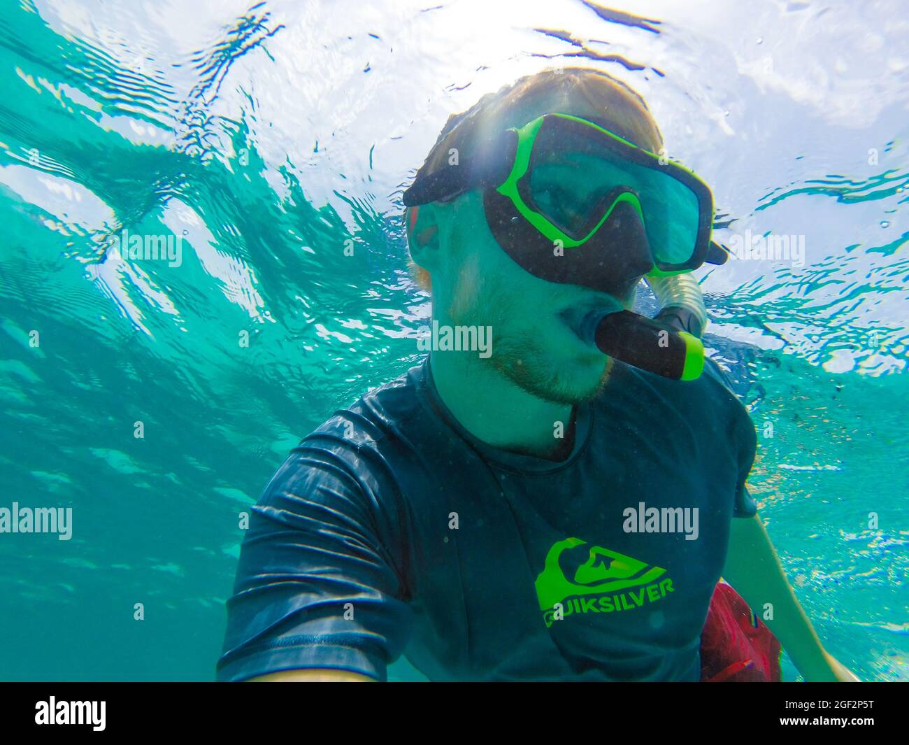 GO SLOW ISLAND, BELIZE - Aug 02, 2018: An adventurous young male ...