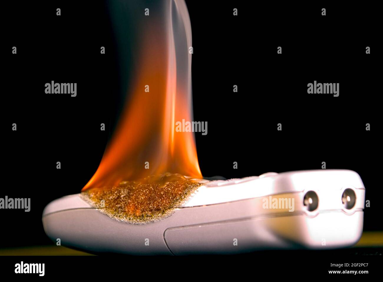 burning cordless phone Stock Photo - Alamy