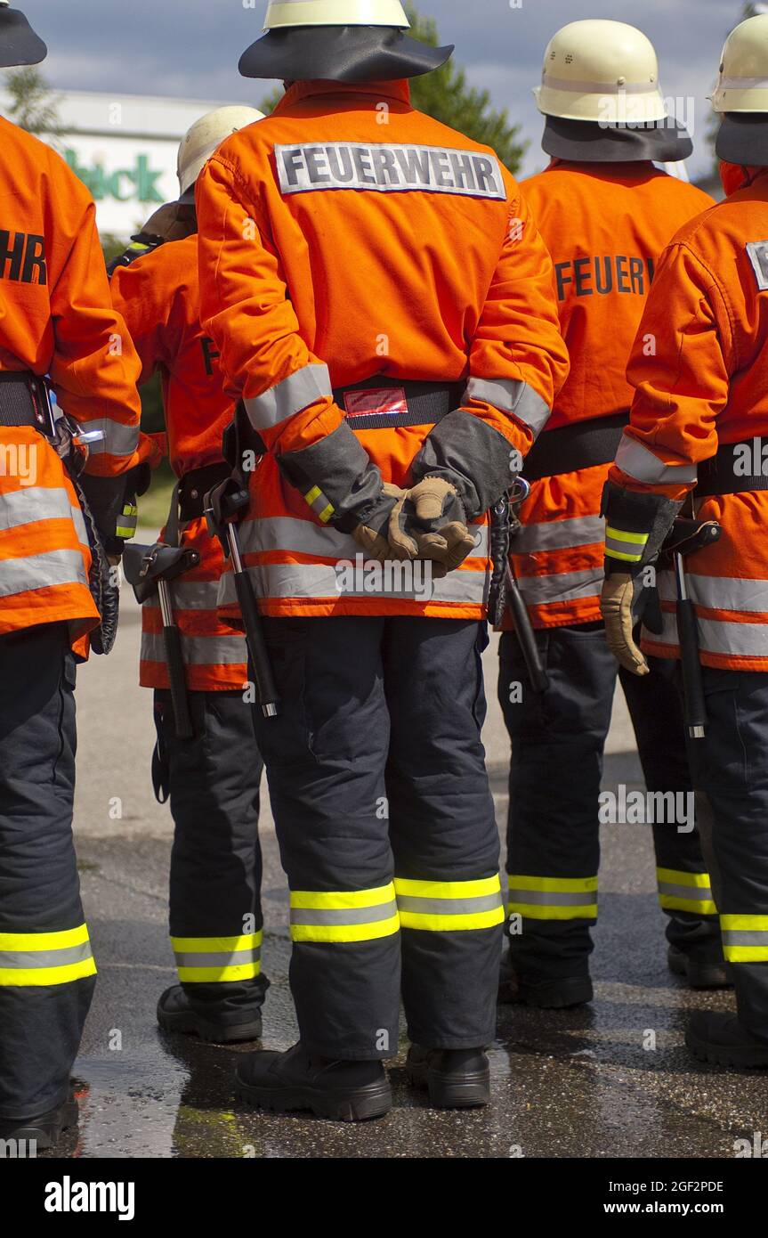 firefighters standing together, rear view , Germany Stock Photo - Alamy