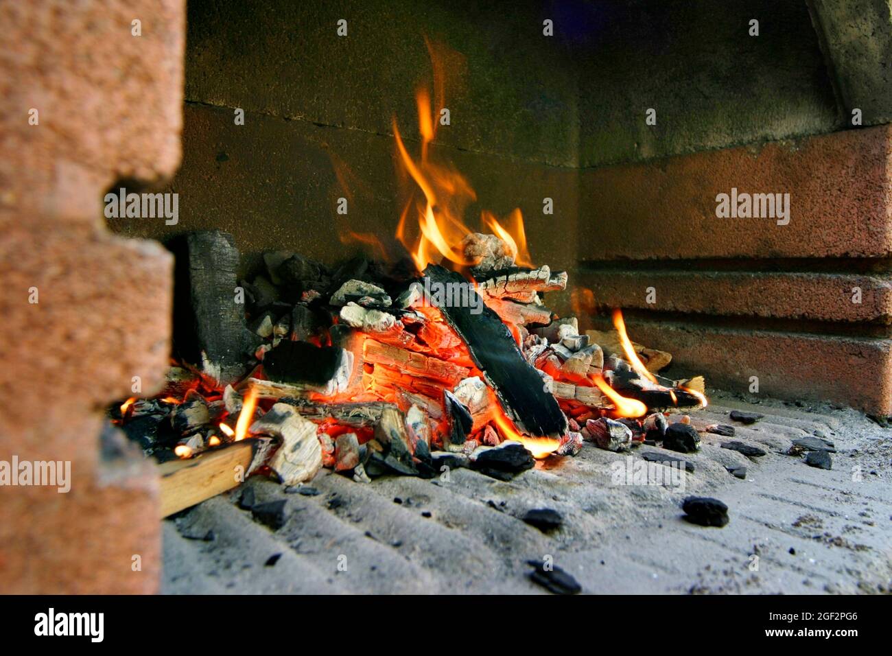 fire in a barbecue chimney Stock Photo - Alamy