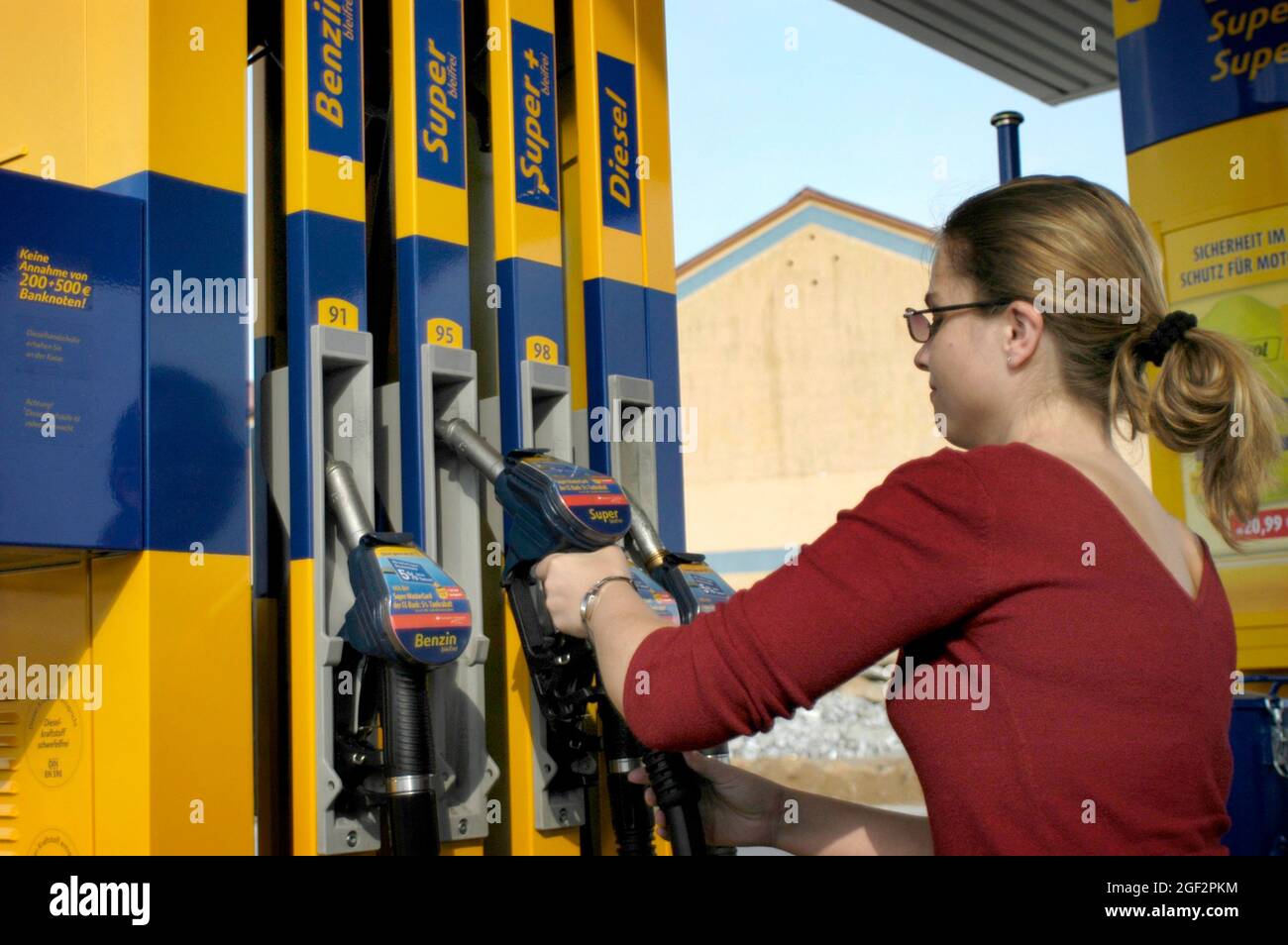 female car driver at the petrol pump, Germany Stock Photo - Alamy