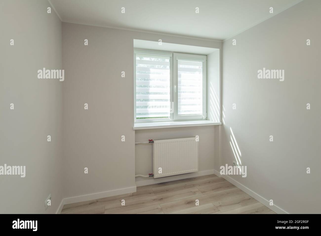 Contemporary apartment. Light interior of empty renovated room. Heating ...