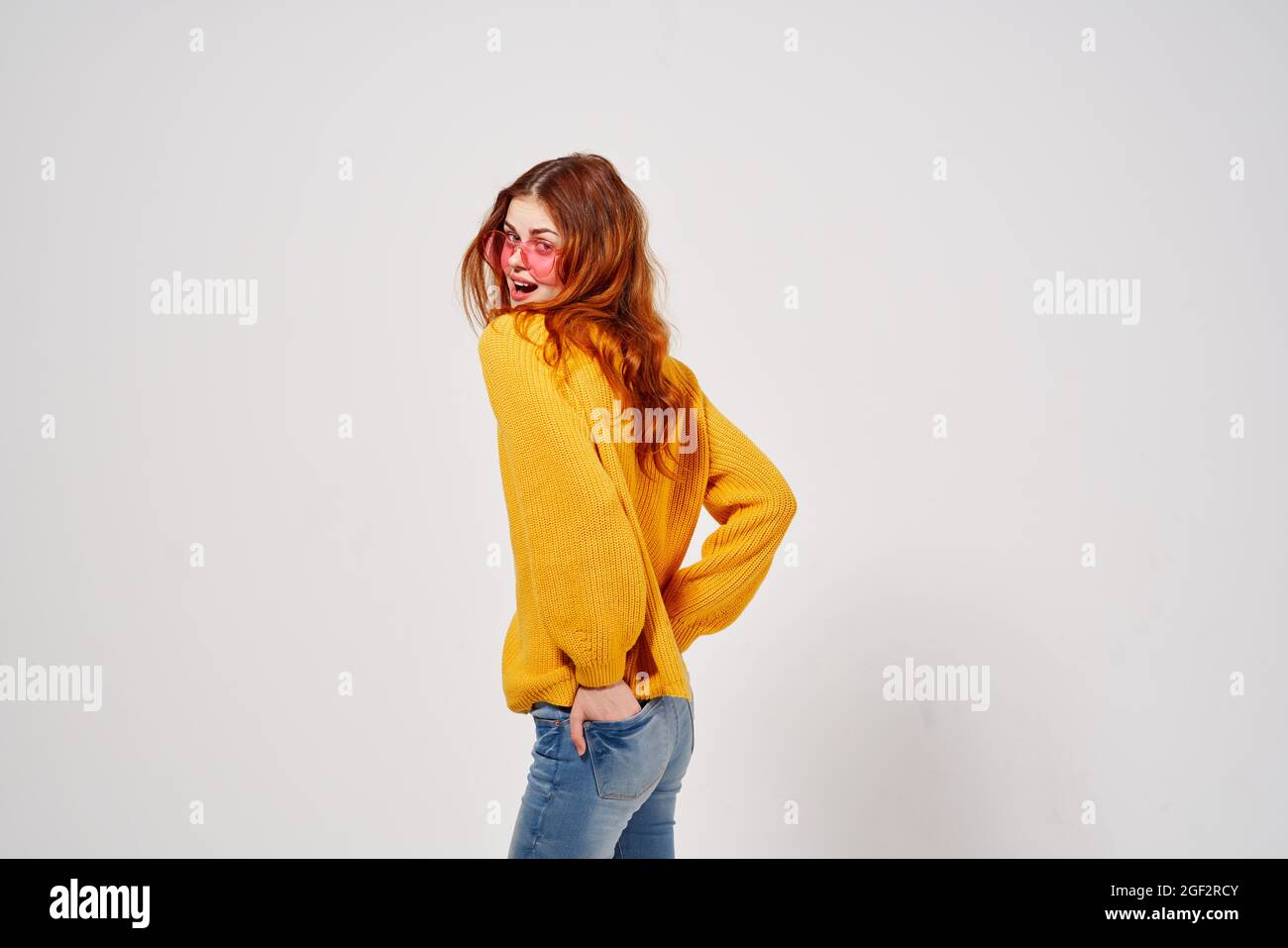 pretty woman in a yellow sweater hairstyle posing Studio fun model ...