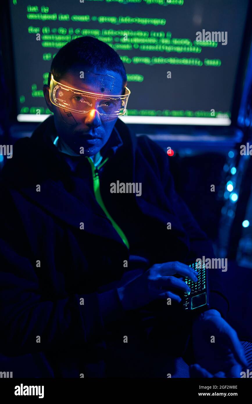 Portrait of a cyber hacker stealing information using a computer ...