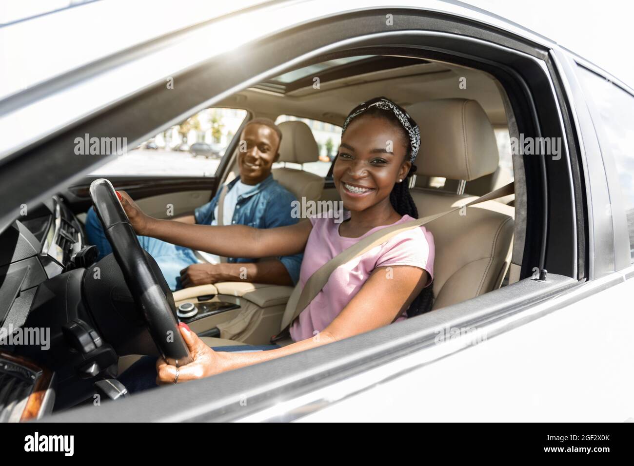 Emotional black family having car ride on weekend Stock Photo - Alamy