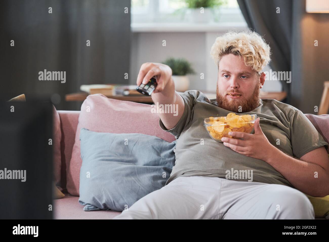 Overweight sitting sofa hi-res stock photography and images - Alamy