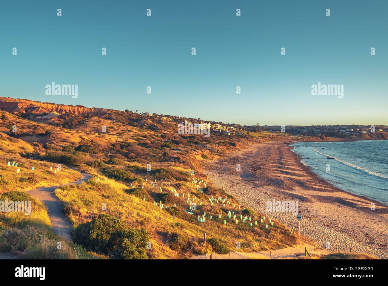 Coastal view of Hallett Cove with the beach and houses at sunset ...