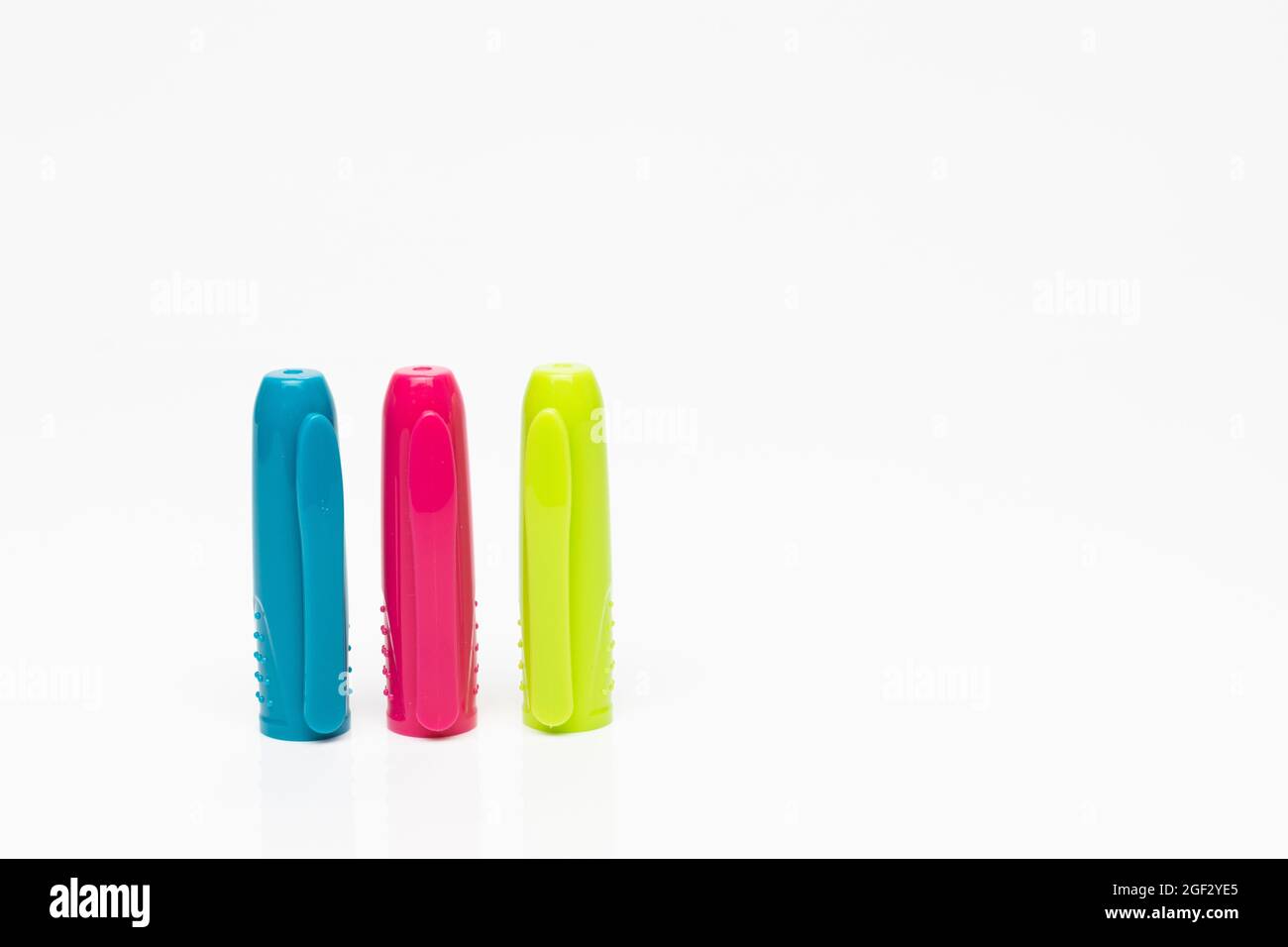 Closeup of colorful pen caps on white background Stock Photo - Alamy