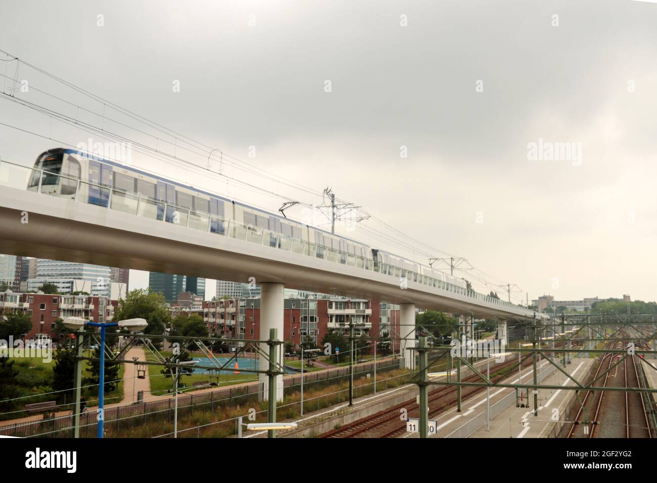Subway Metro train of RET Randstadrail high on viaduct in the ...