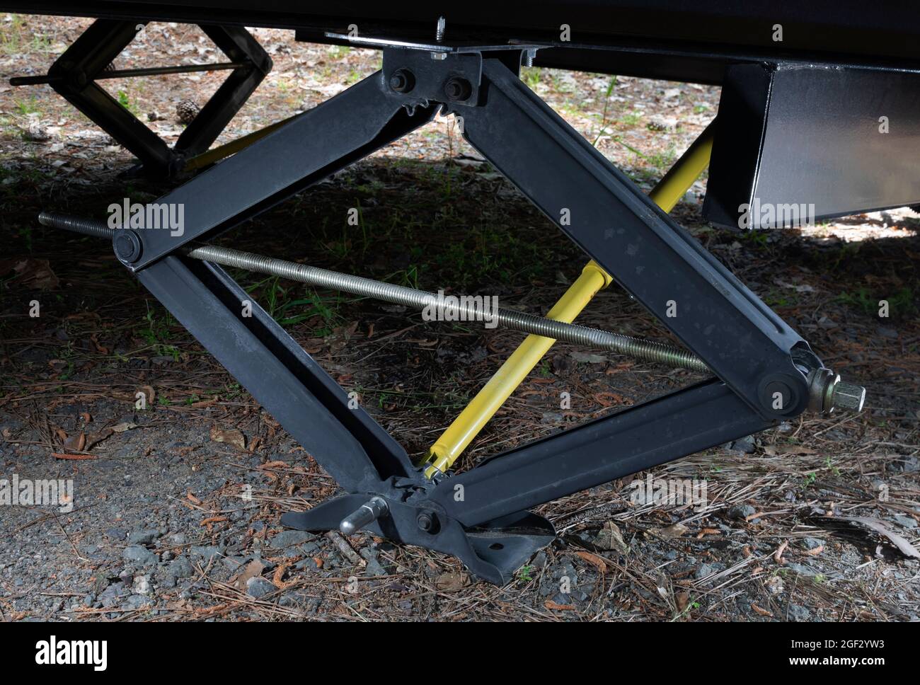 Brace under a camping trailer called an outrigger extended and on the ...