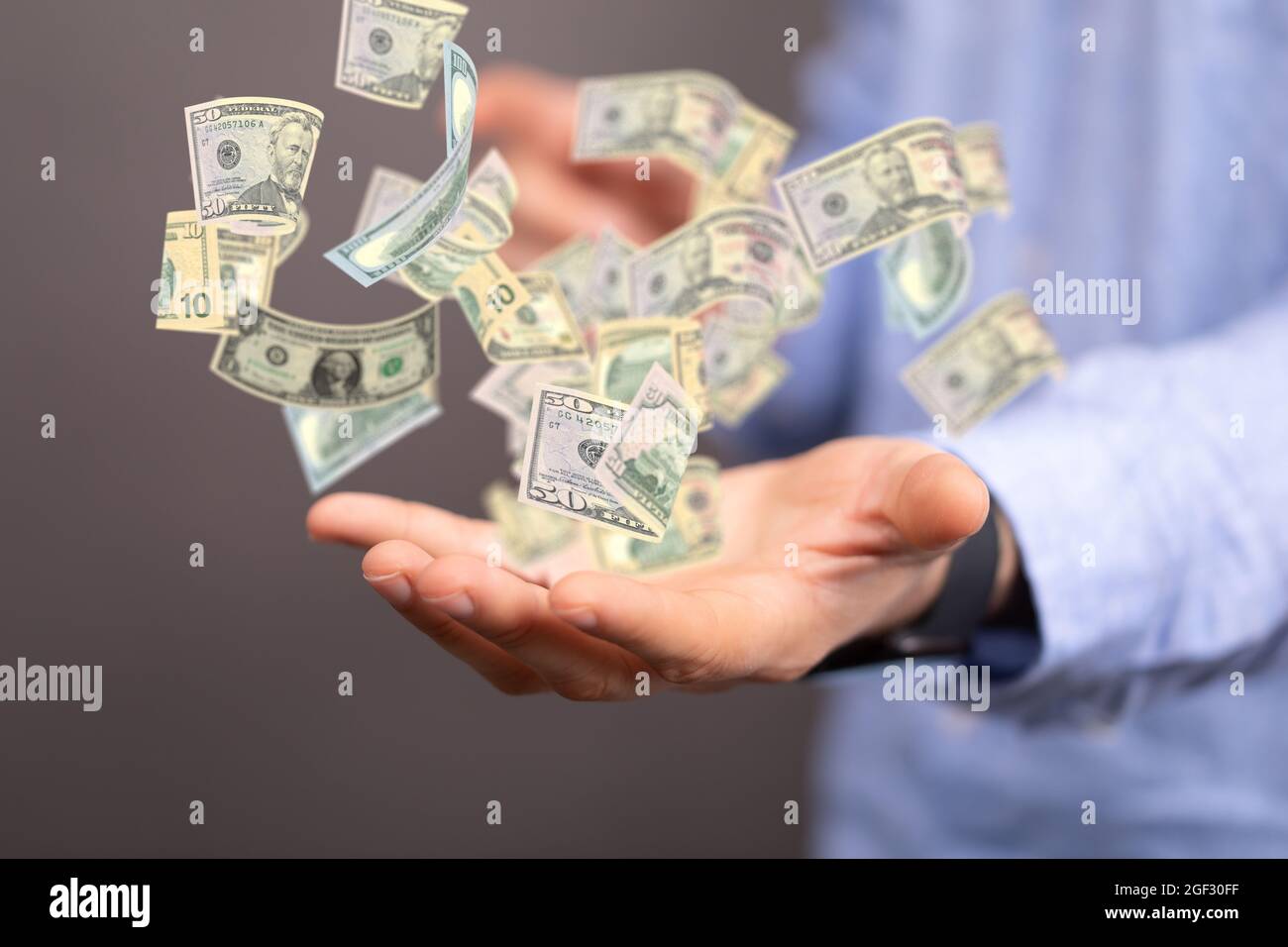 Person holding a 3D render of floating dollar banknotes Stock Photo - Alamy