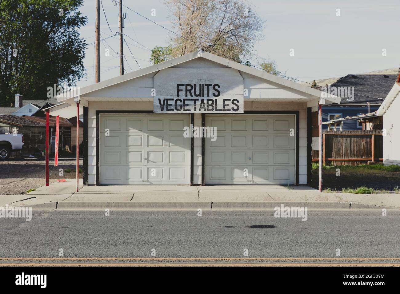 Fruits and Vegetables sign and a closed market stall on a small town ...