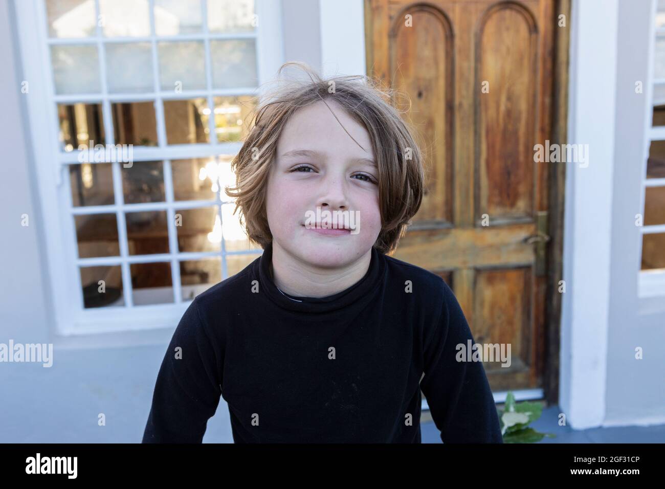 Young boy outside his home, portrait Stock Photo - Alamy