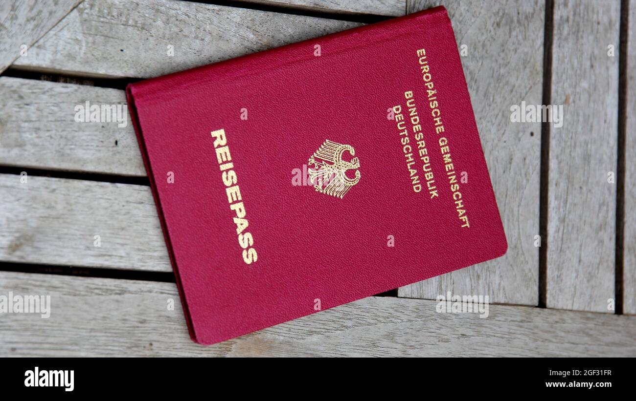 Top view of the red German passport on the wooden surface Stock Photo ...
