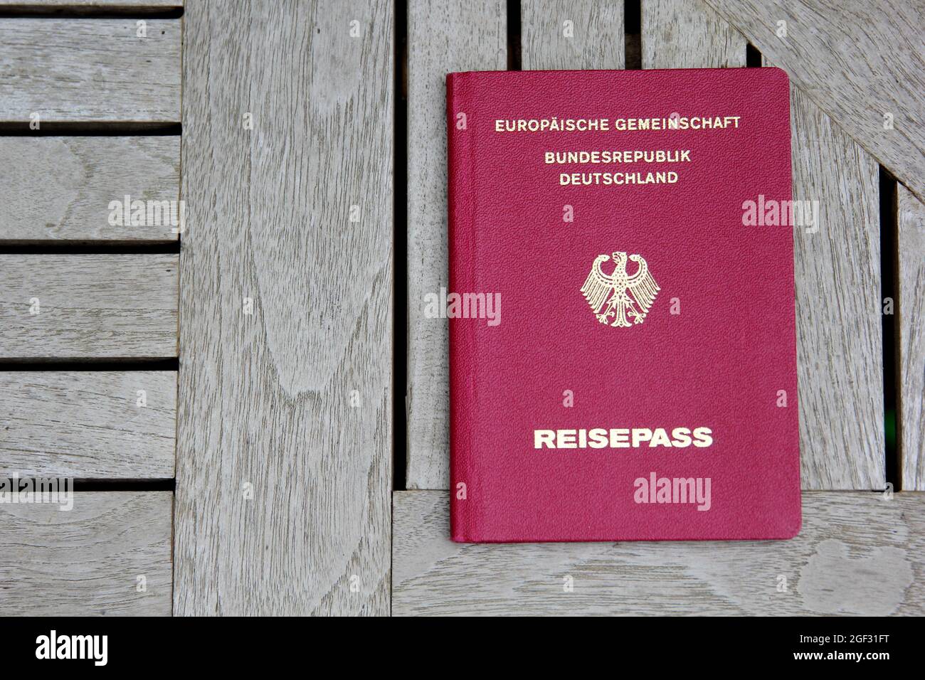 Top view of the red German passport on the wooden surface Stock Photo ...