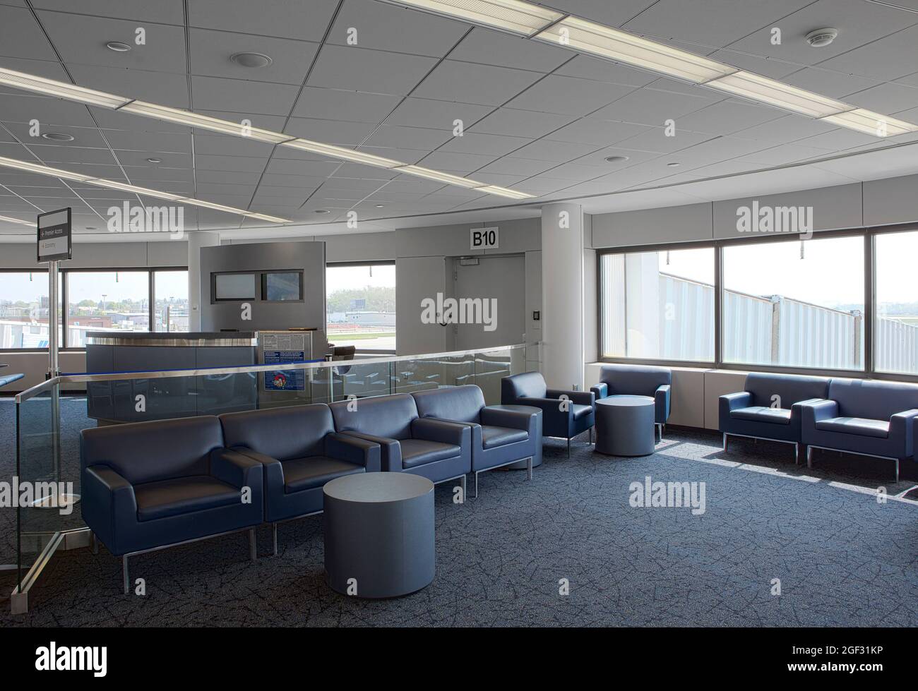Empty airport lounge, with seats and windows, a departure gate lounge ...