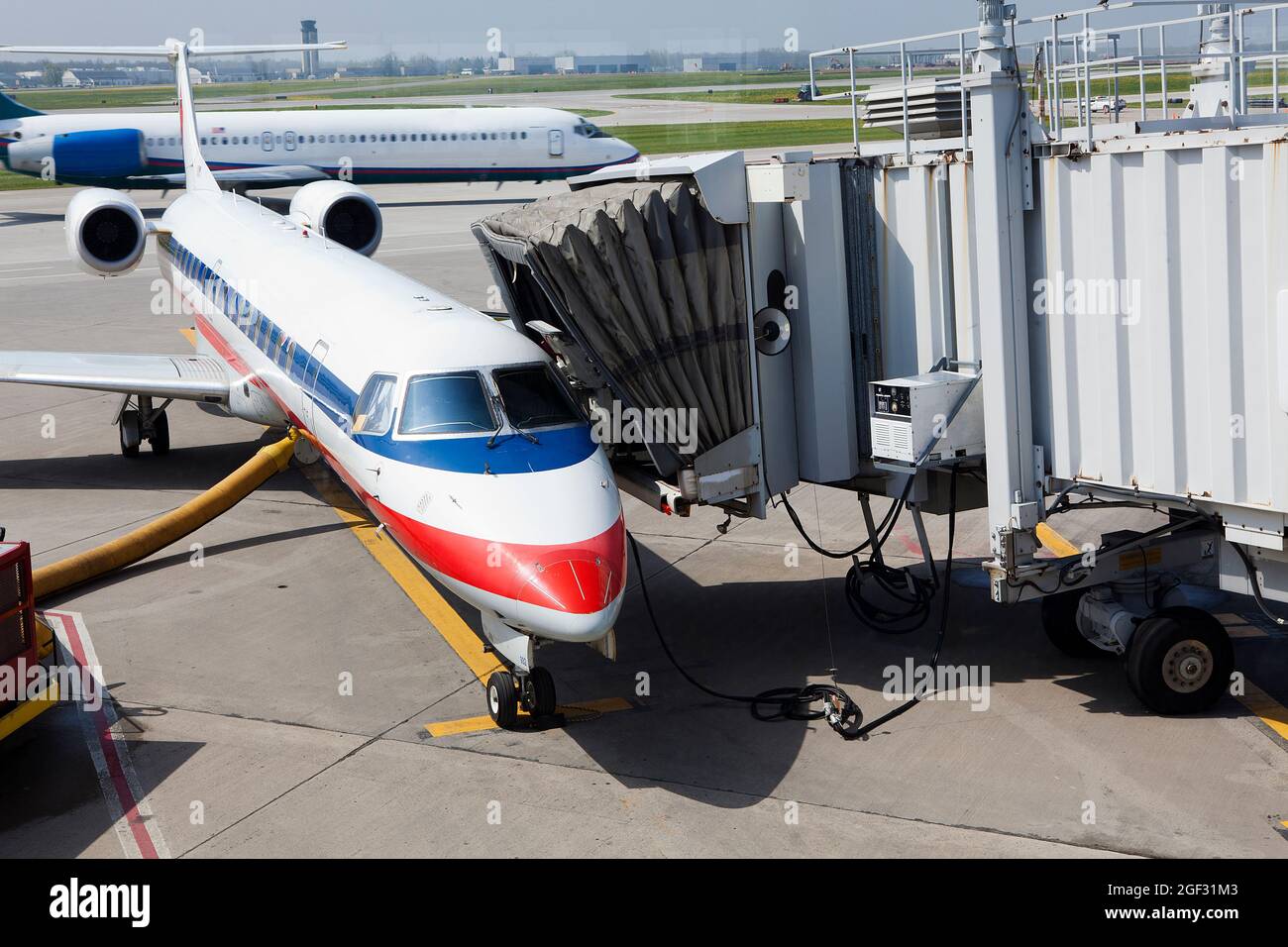 A passenger aircraft and connected passenger boarding tunnel or ...