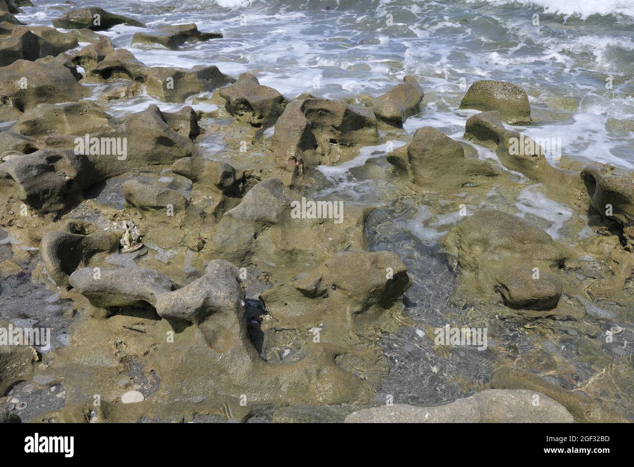 Waves splashing the rocks in the natural preserve Florida, USA, coral ...