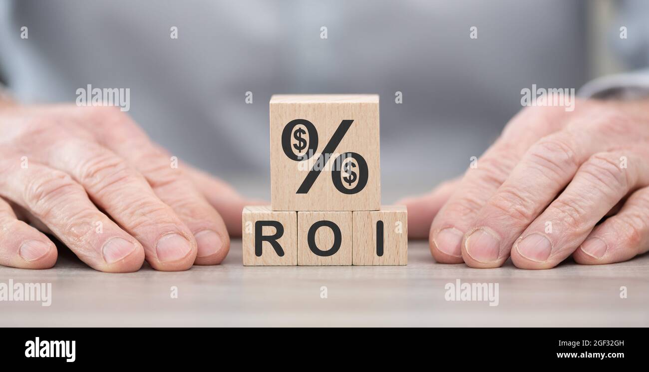 Wooden blocks with symbol of roi concept Stock Photo - Alamy