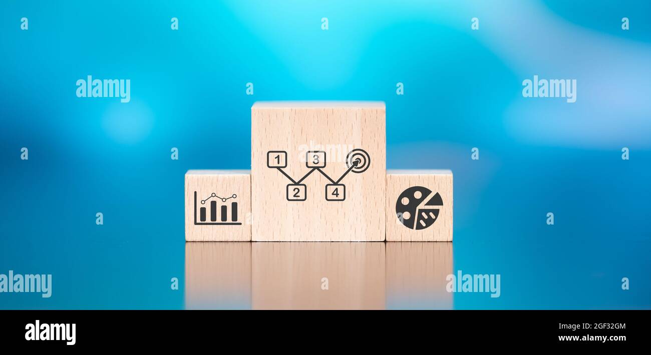 Wooden blocks with symbol of action plan concept on blue background ...