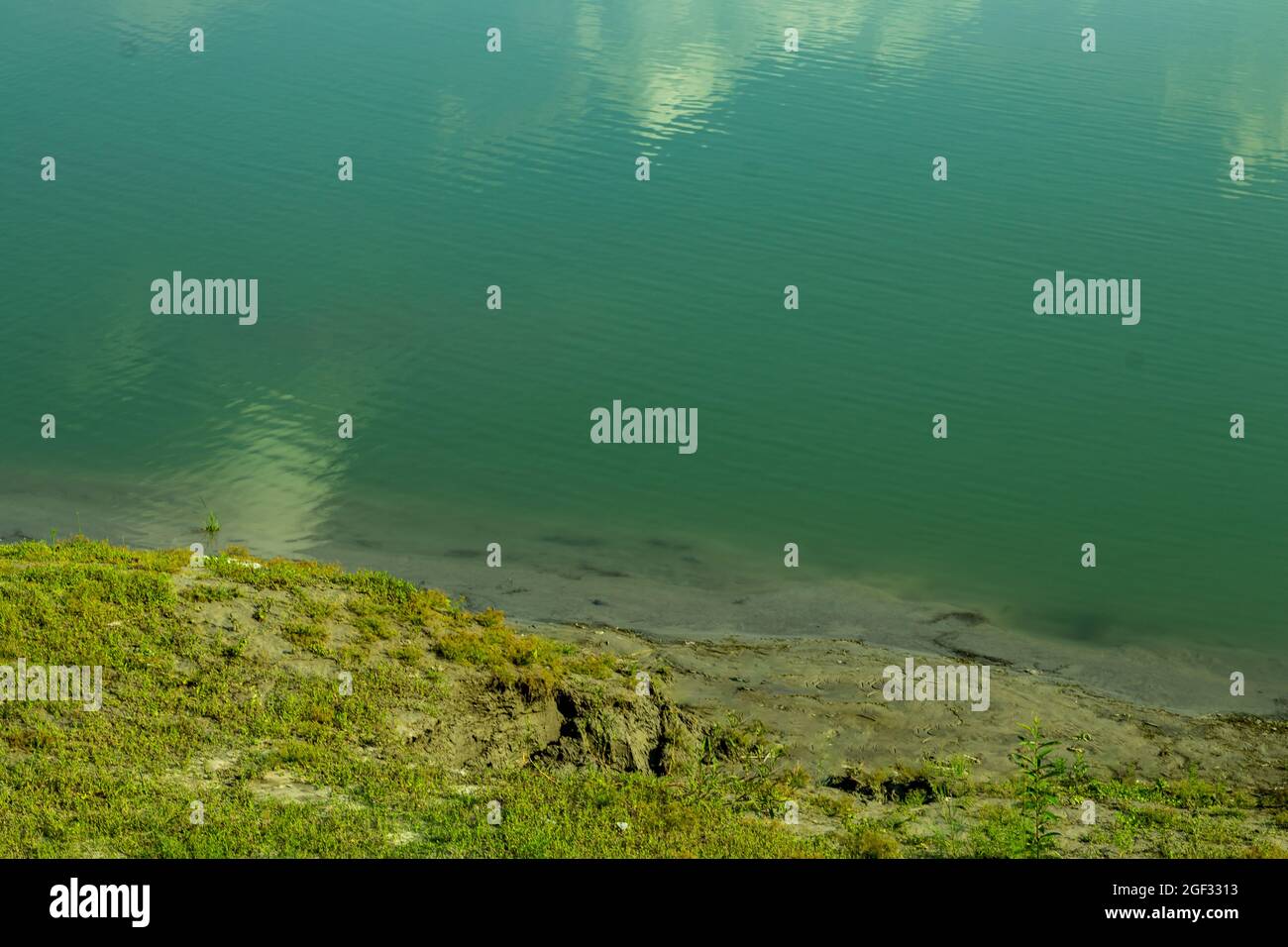 White clouds have been created the shadow on the blue water of the ...