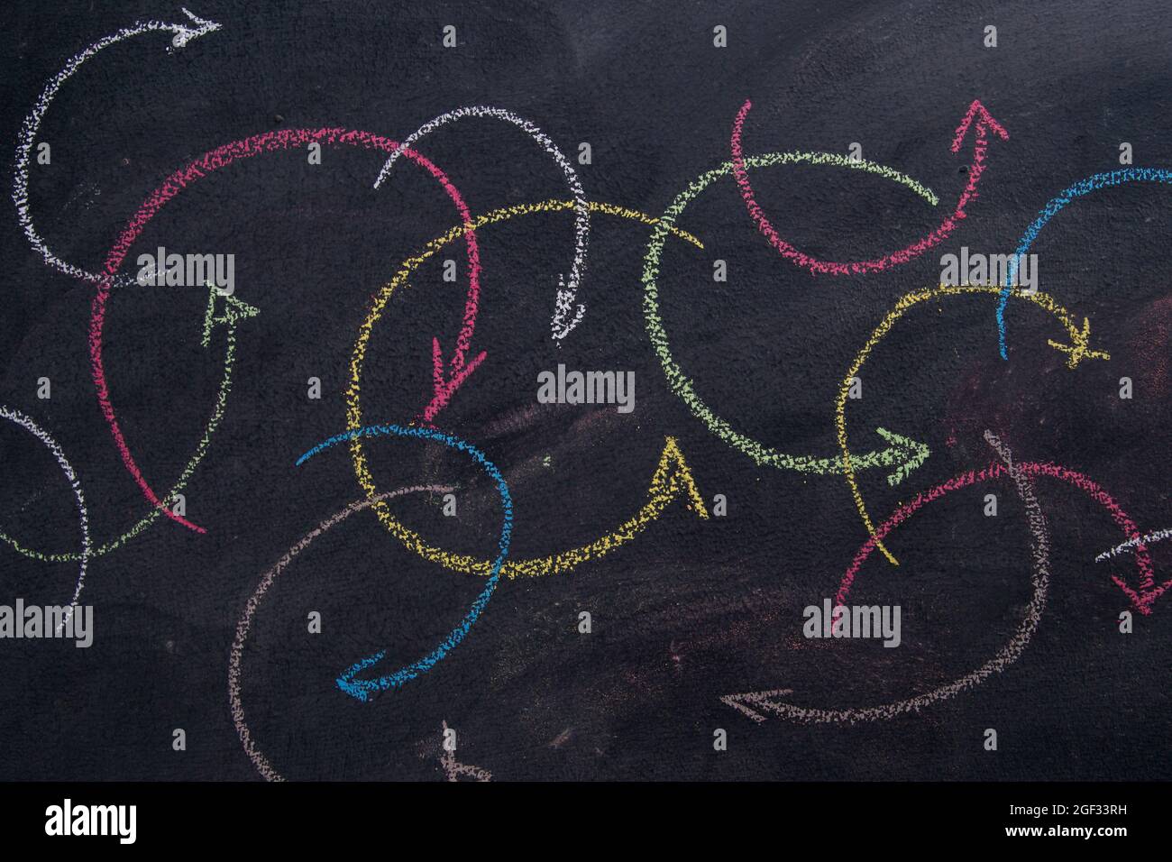Colorful curved arrows drawn with chalk on blackboard Stock Photo - Alamy