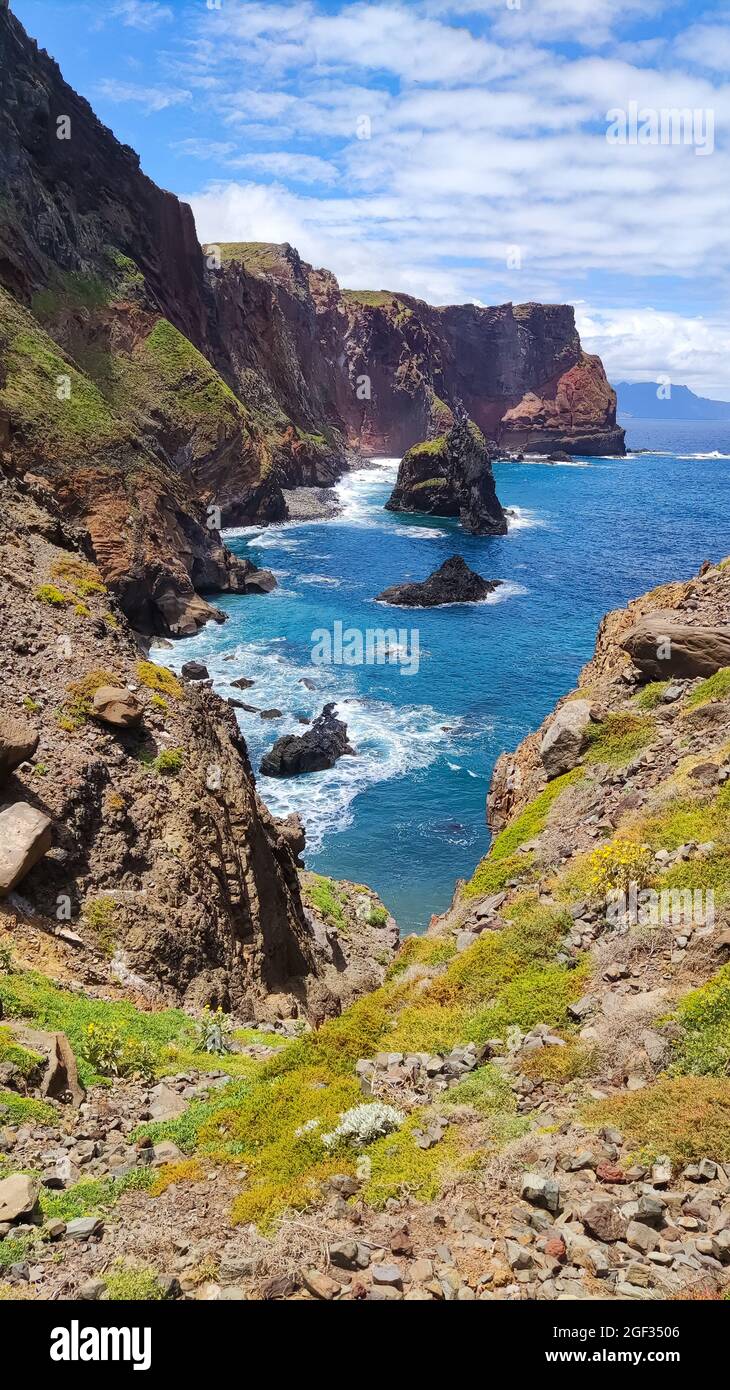 Vertical shot of the blue ocean with cliffs. Sao Lourenco Peninsula ...