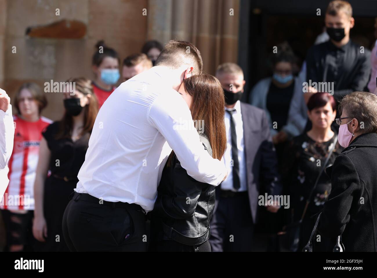 Husband Josh is given a hug after the coffin of Samantha Willis (nee ...