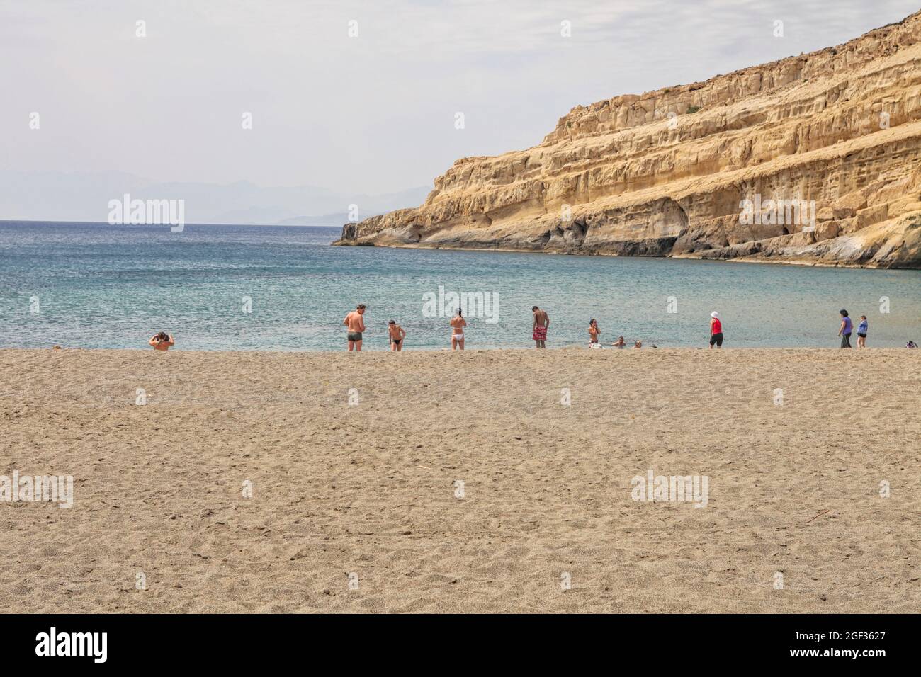 People enjoying the beach at Matala, Crete, Greece Stock Photo - Alamy