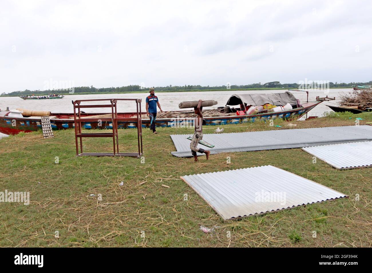 shows the eroded bank of a river in munshiganj district, Some 53 km ...