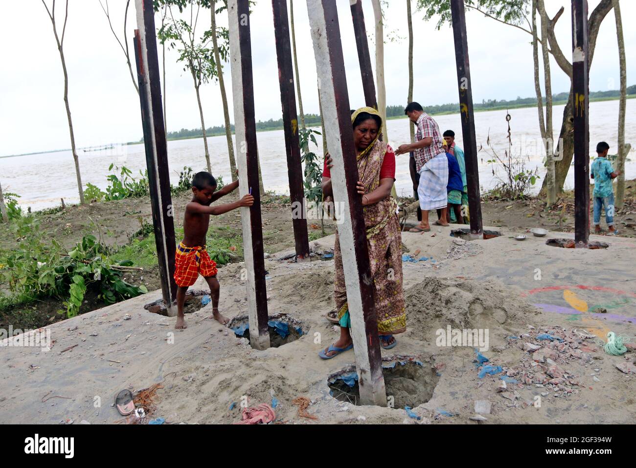 shows the eroded bank of a river in munshiganj district, Some 53 km ...