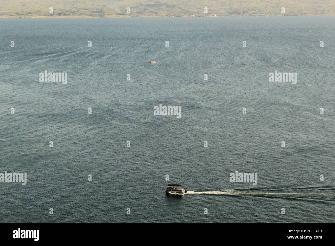 Landscape with a boat floating in Sevan lake at daytime Stock Photo - Alamy