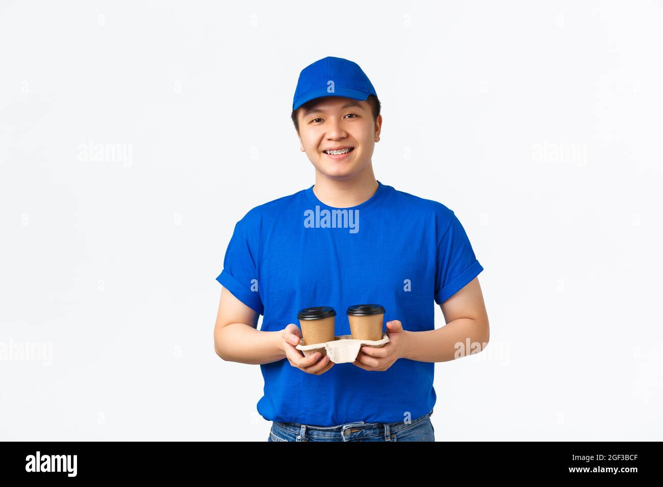 Online orders, takeaway and employees concept. Friendly smiling asian ...