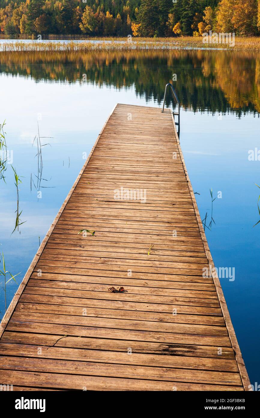 Autumn foliage wooden jetty hi-res stock photography and images - Alamy