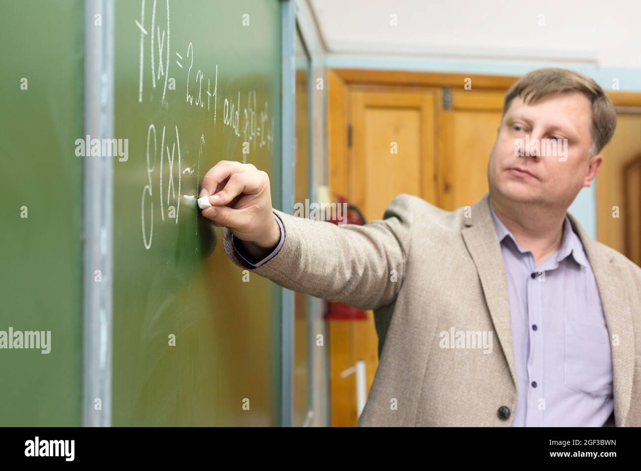 Professor of the Department of Applied Mathematics in the classroom at ...