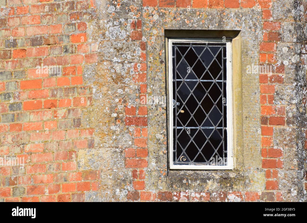 Historic leaded lights window on an old building Stock Photo - Alamy