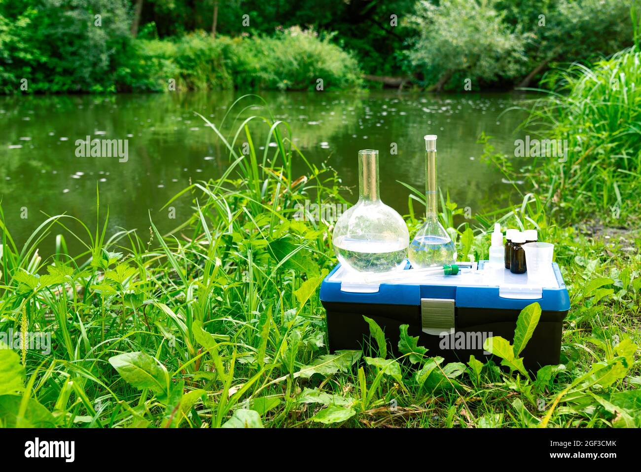 Chemical flasks and chemicals in glass bottles against the background ...