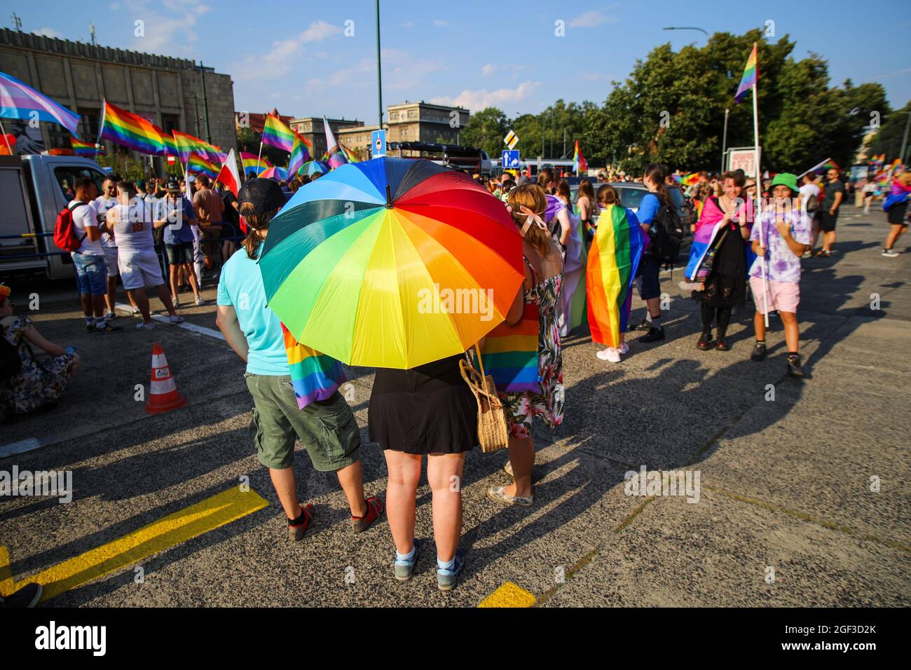 Member of Polish LGBTQ community is seen with rainbow umbrella during ...