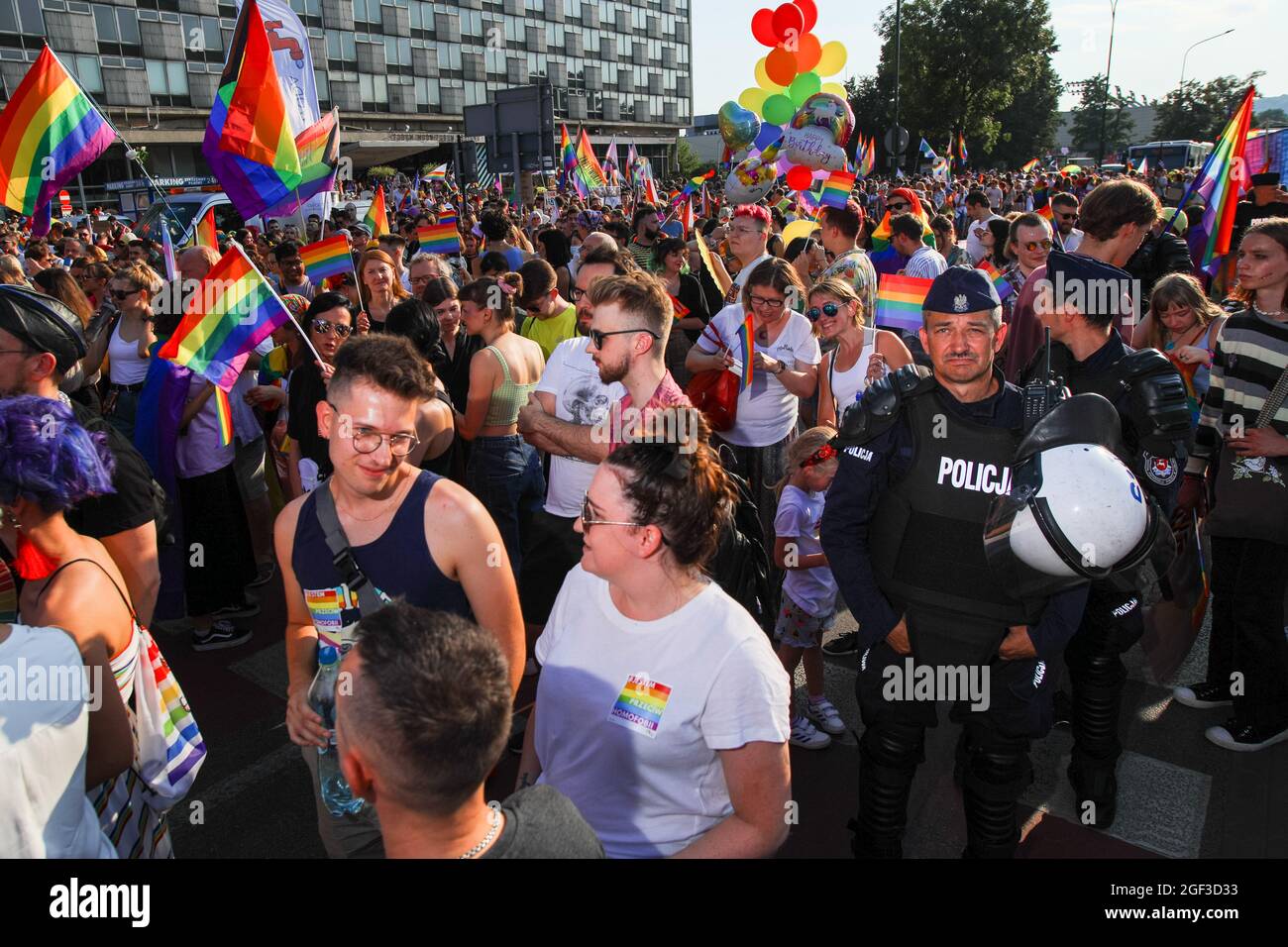 A riot policeman is seen standing among the march participants with ...