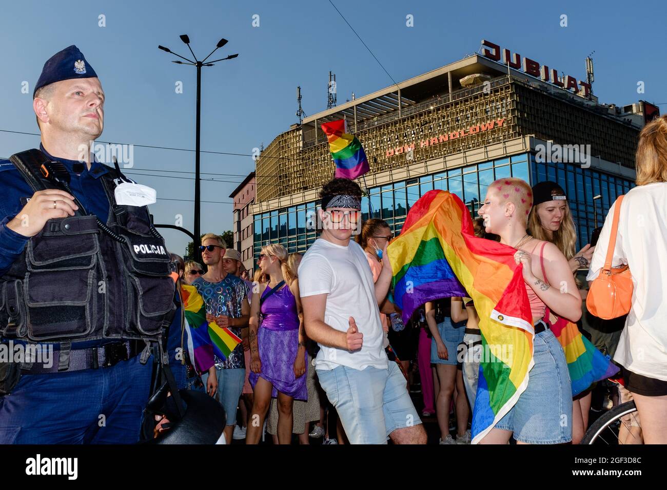A Police Officer Is Seen In Front Of The Members Of Polish Lgbtq Community With Rainbow Flags