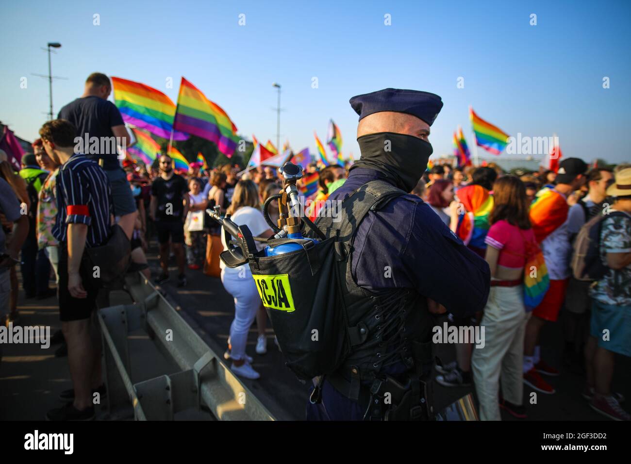 A riot police officer with a tear gas thrower on his back is seen ...