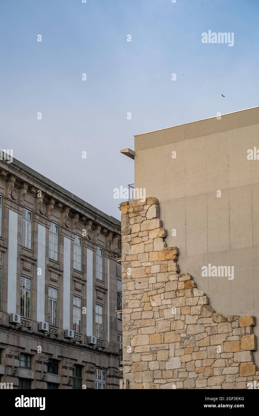 Stone building wall with windows and reflections in them Stock Photo ...