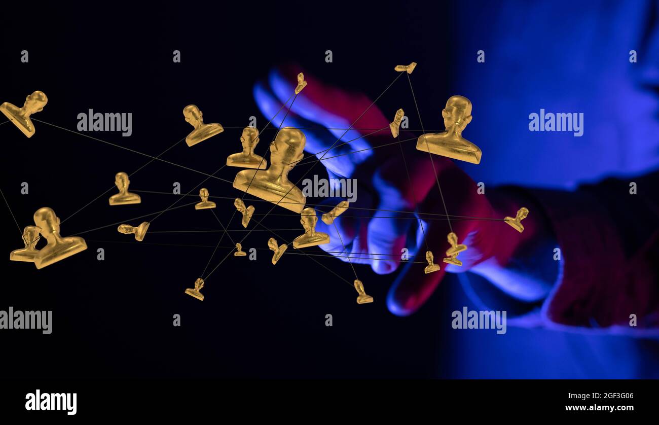 Closeup of people symbols floating above a man's hands, digital ...