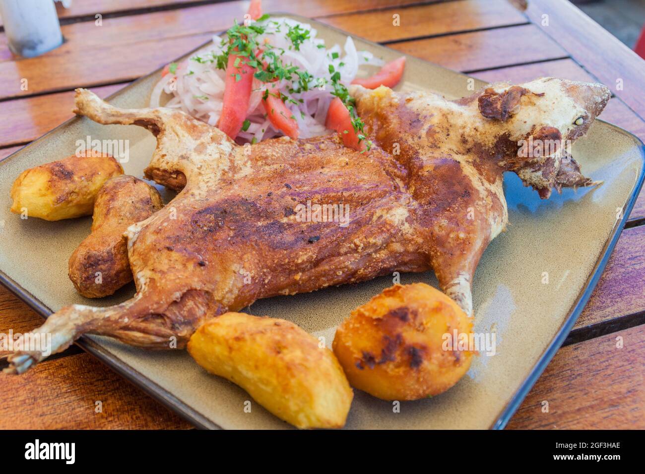 Roasted guinea pig, traditional meal in Peru Stock Photo - Alamy