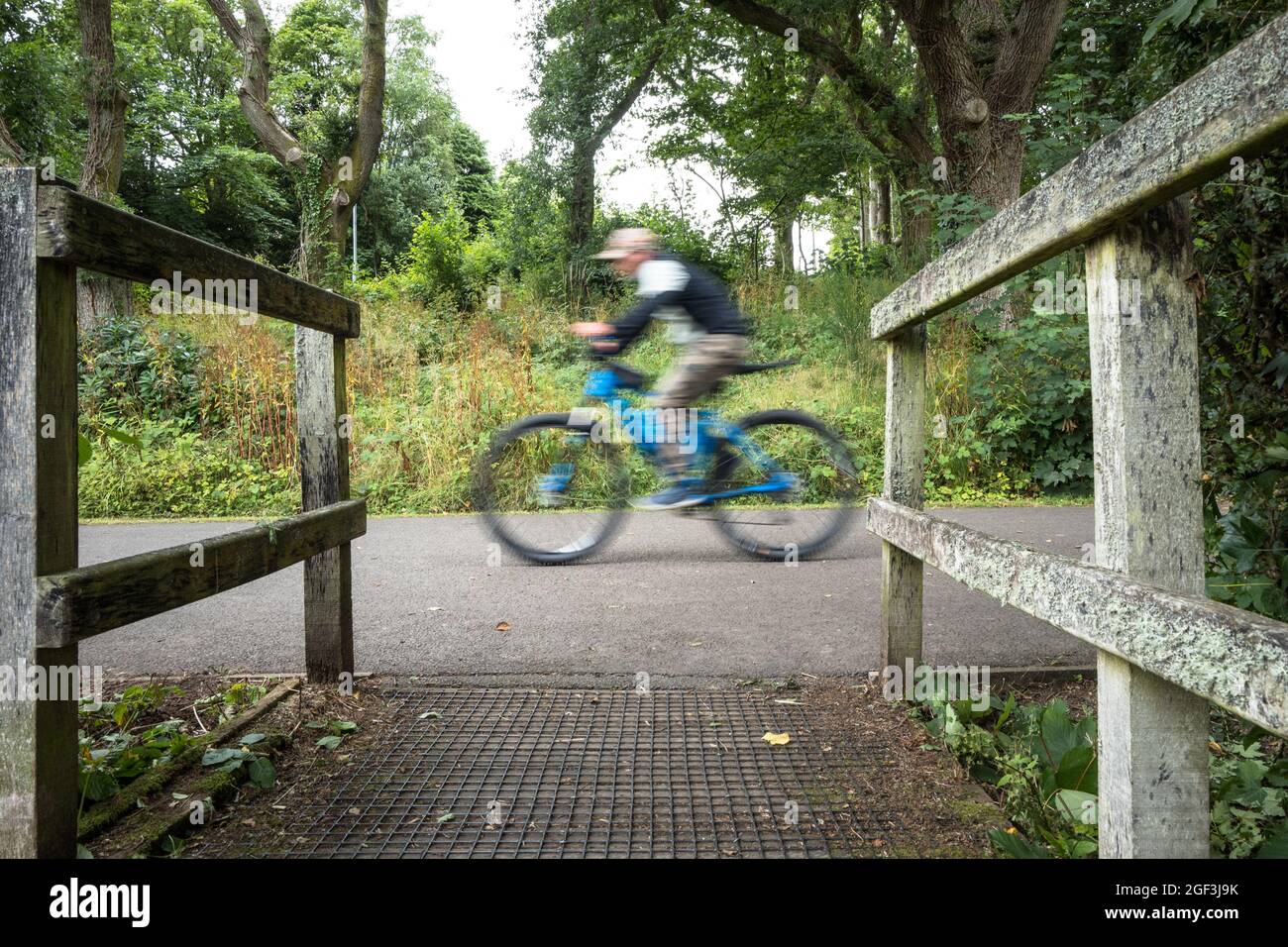 Slow motion of a male riding a bike Stock Photo - Alamy