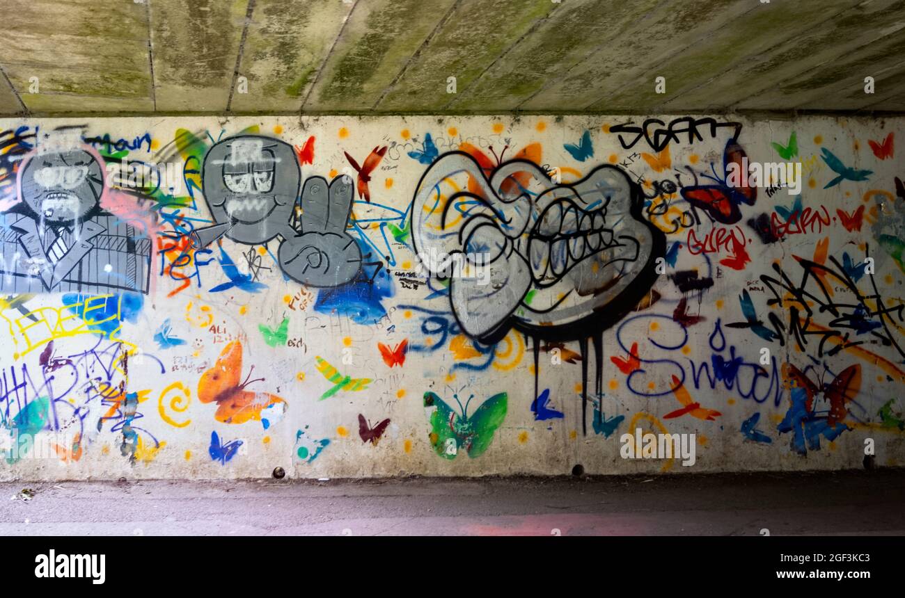 Colourful graffiti under bridge on Grand Union Canal Buckinghamshire UK ...
