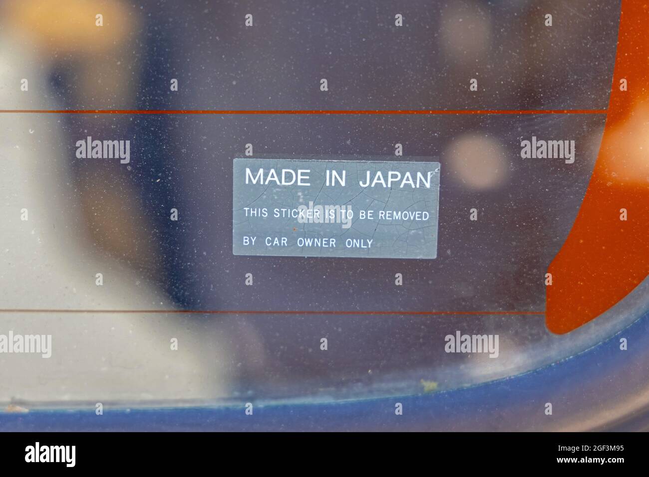 Faded Sticker Made in Japan at Old Car Glass Stock Photo - Alamy