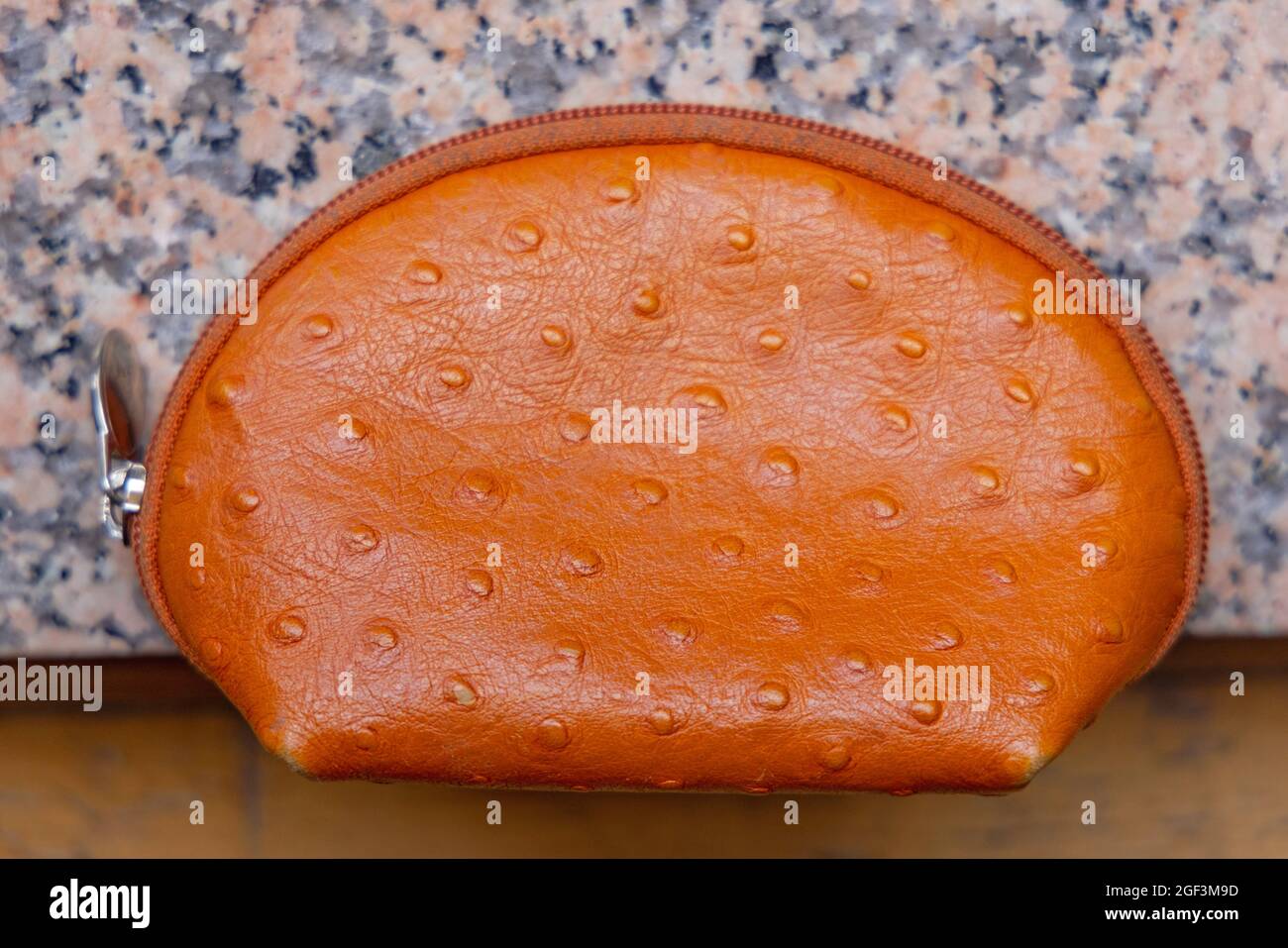 Small Orange Purse With Ostrich Leather Pattern Stock Photo - Alamy