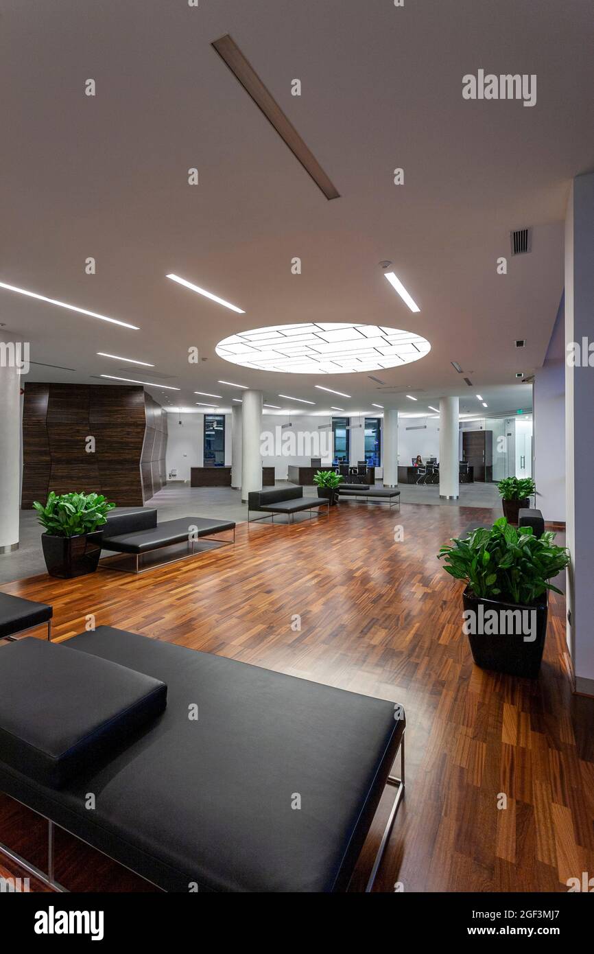 Office interior design, entrance hall with nice couch Stock Photo - Alamy