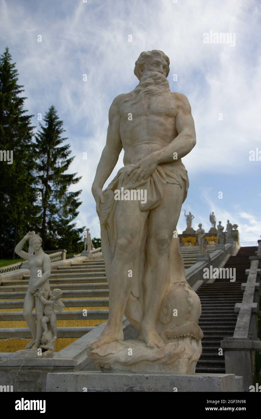 Low angle shot of a white stone statue on the staircase of Peterhof ...